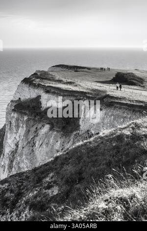 Walkers on the chalk coast, monochrome, Beachy Head, Eastbourne, South ...