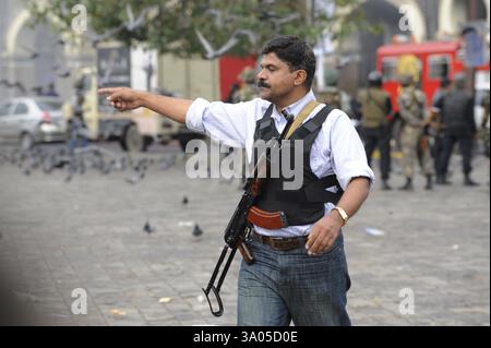 MUMBAI, INDIA - NOVEMBER 26: Mumbai Police personnel salutes the ...