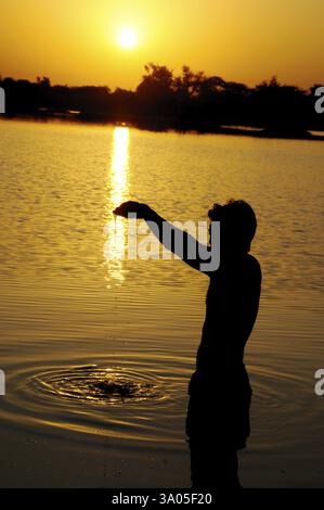 Man worshiping sun, India, Asia Stock Photo - Alamy