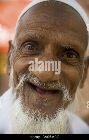 Elderly Indian Muslim man with Islamic beard, tooth gap and Muslim ...