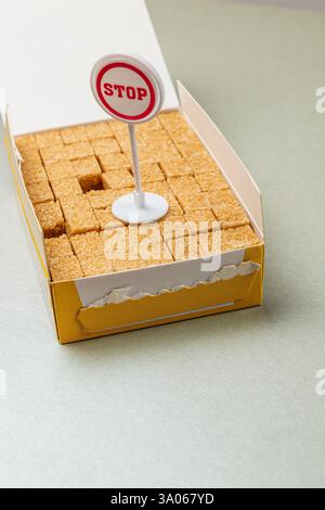 A box filled with brown sugar cubes neatly organized, featuring a ...