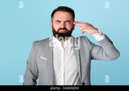 discouraged man pointing at himself with finger while talking on ...