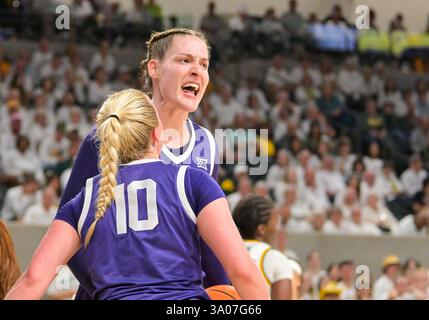 TCU guard Hailey Van Lith drives to the basket between Texas guard Rori ...