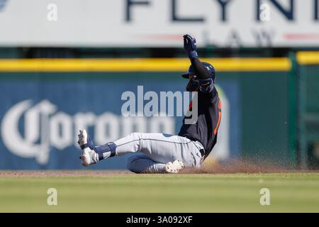 Detroit Tigers' Dillon Dingler, left, beats the tag at the plate by ...