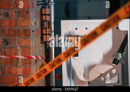 Bomb is planted near fire hose. Explosive is indoors. Police ...