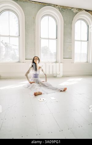 Ballerina resting on floor Stock Photo - Alamy