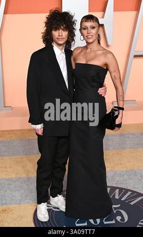Miley Cyrus and Maxx Morando arriving to the world premiere of “Avatar ...