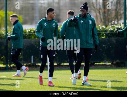 Aston Villa's Axel Disasi (right) and team-mates react after they ...