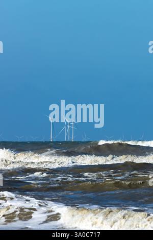 Offshore windmill park in a stormy north sea with spindrift waves Stock ...