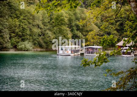Small harbor at Plitvice lakes, Croatia. Pure blue water in lakes ...