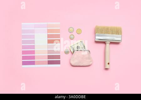 Wallet with money, paint roller and color palettes on pink background ...