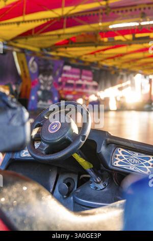 Empty bumper car hall with colourful vehicles, ready for visitors at a ...