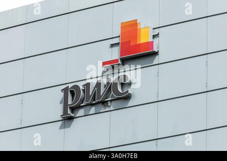 PWC logo sign. PricewaterhouseCoopers International Limited is a ...