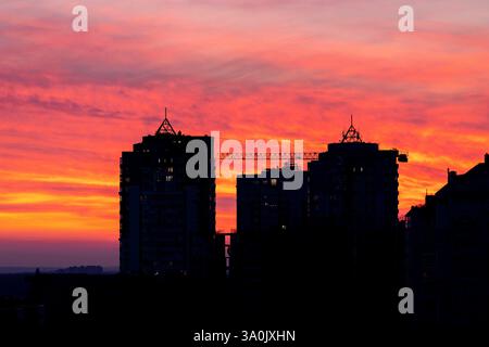 Beautiful sunset behind high-rise buildings of Kyiv Stock Photo - Alamy