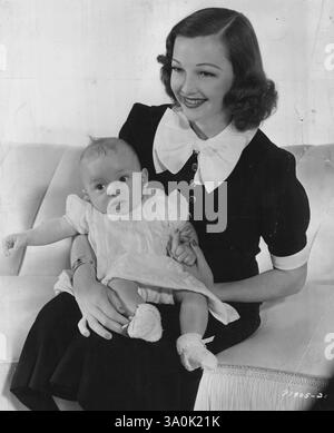 BING CROSBY and his first wife DIXIE LEE at home with their three week old son GARY EVAN CROSBY ...