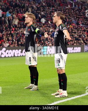 Arsenal's Martin Odegaard (right) and team-mates during a training ...
