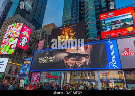 Evening crowd and digital billboards at Times Square with Spotify and ...