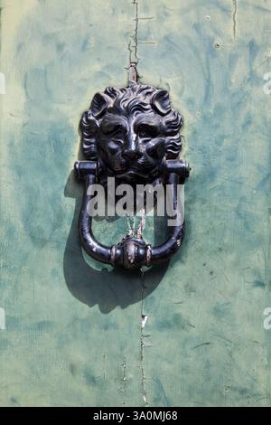 Old knocker. Old brass knocker on wooden door. Retro style photo Stock ...
