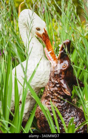 clay figurines of an heron and a dog Stock Photo - Alamy