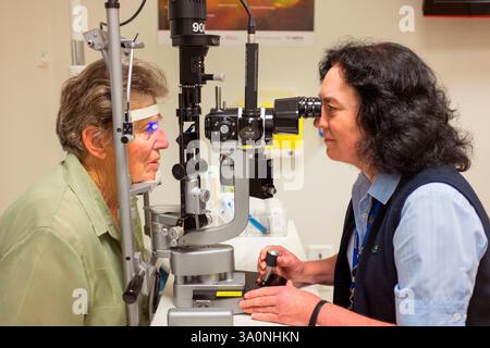 An elderly female patient undergoing an eye check at a hospital in ...