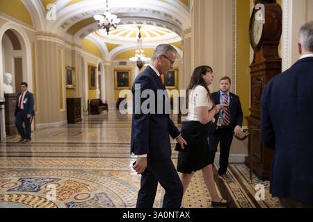 Senate Majority Leader John Thune, R-S.D., walks from the chamber to ...
