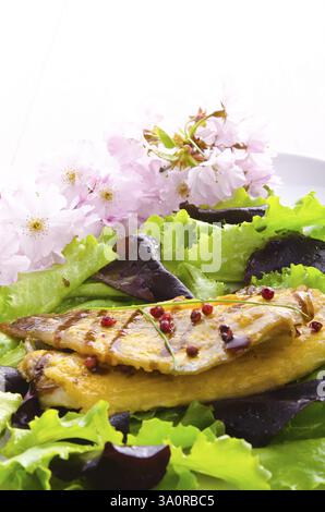 Roasted one fish with balsamic cream ones Stock Photo - Alamy