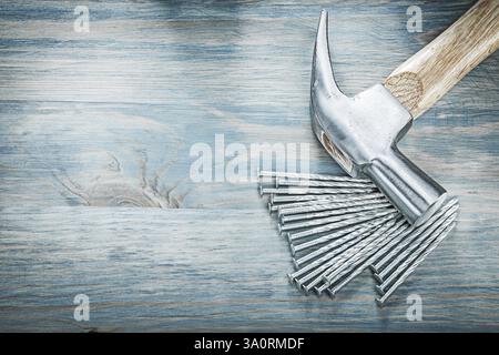 Claw hammer stainless nails on wooden board top view construction ...