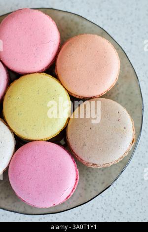 Side view of a multicolored macarons or macaroons, sweet meringue-based ...