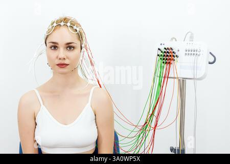 Female patient undergoing an EEG test, showcasing modern healthcare and ...