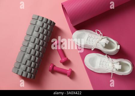 Different gym stuff on pink background, flat lay Stock Photo - Alamy