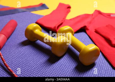 Different gym stuff on yellow background, flat lay Stock Photo - Alamy