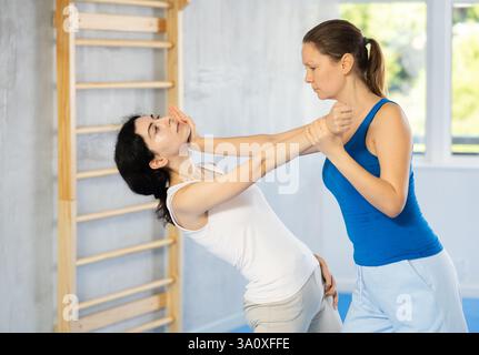 women trained in executing powerful palm punch Stock Photo - Alamy