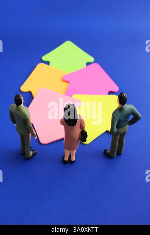 Executive in front of colorful arrows pointing the way forward Stock ...