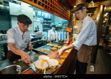 Chef Masanobu Nishikura uses teko spatulas to serve a sizzling ...