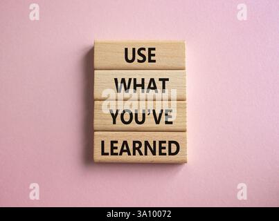 Use what You have learned symbol. Wooden blocks with words Use what You ...