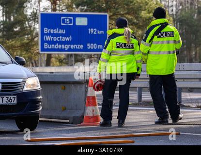 Federal immigration officers stand near their vehicles Thursday, Jan ...