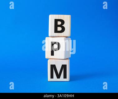 BPM - Business Process Management symbol. Wooden cubes with words BPM ...