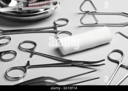 Different surgical instruments on light grey background, closeup Stock ...