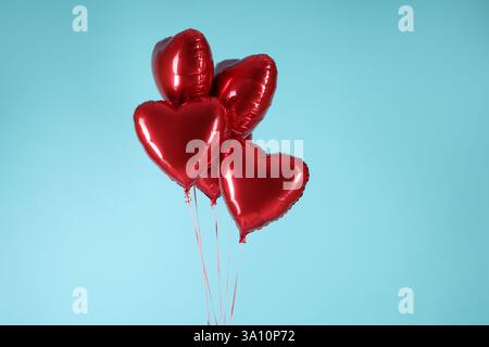 Many red heart shaped balloons on light background. Valentine's Day ...