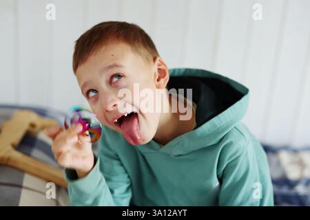 A 7-year-old boy smiles joked without two front teeth Stock Photo - Alamy