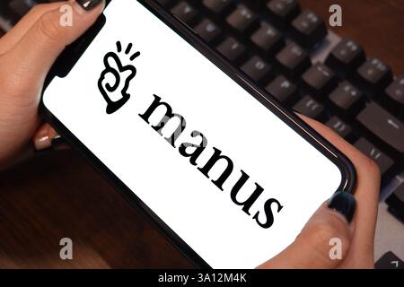 In this photo illustration, a Manus logo is displayed on the screen of ...