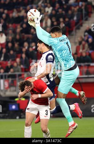 Tottenham Hotspur's Dominic Solanke (centre) is challenged by ...