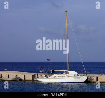Yacht moored at Livadia harbour, Tilos Island, Dodecanese, Greece ...