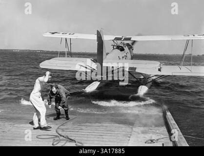 Heinkel He 60 seaplane taking off from a naval air base. [automated ...