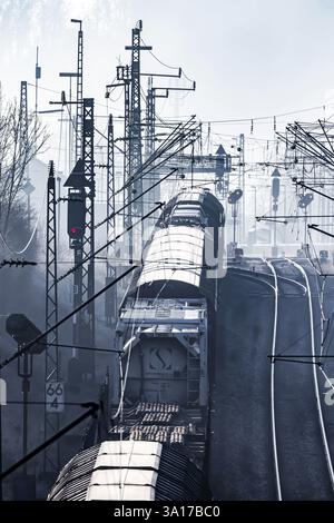 Deutsche Bahn AG tracks backlit with RegionalExpress. Overhead line ...