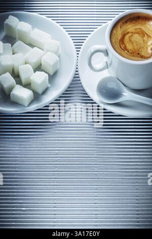 Saucer with sugar cubes on striped background Stock Photo - Alamy
