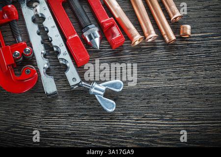 Copper flared pipes flaring clamp brake plumber on wooden board Stock ...