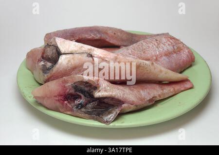 snapper fish, raw, sliced and peeled, prepare for cooking, stacked on ...