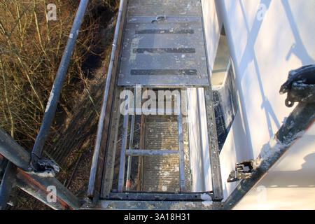 Open lid on a ladder on a scaffold Stock Photo - Alamy