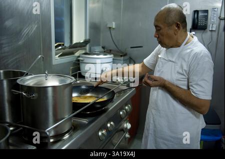 Galley kitchen of Container Ship with Crew Chef smiling preparing meal ...